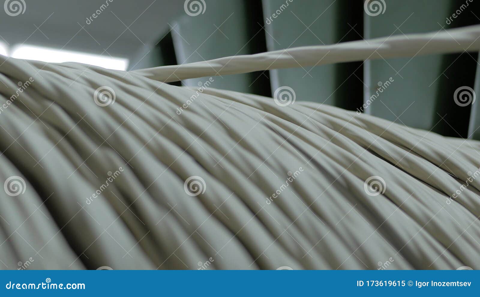 Winding Cable on a Rotating Coil. Production of Electric Cable. Stock ...