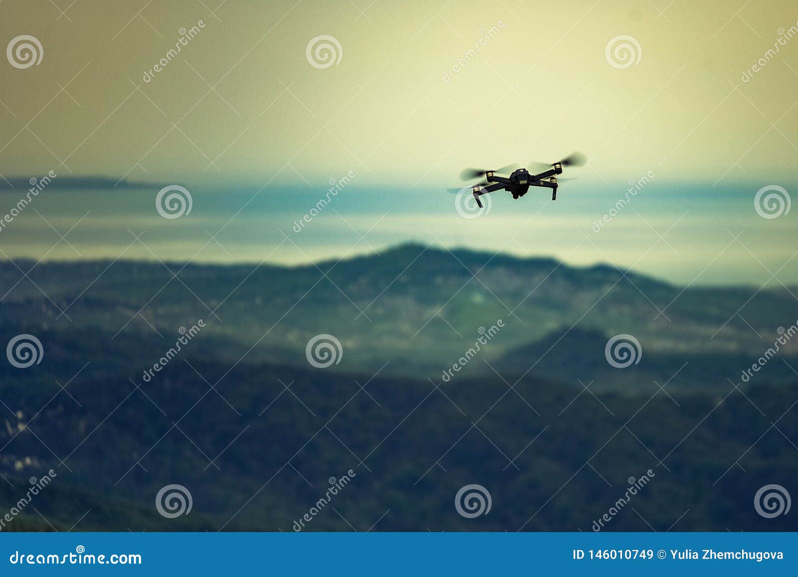 Copter in Flight Over the Mountains on the Horizon Sea Sunset Stock ...