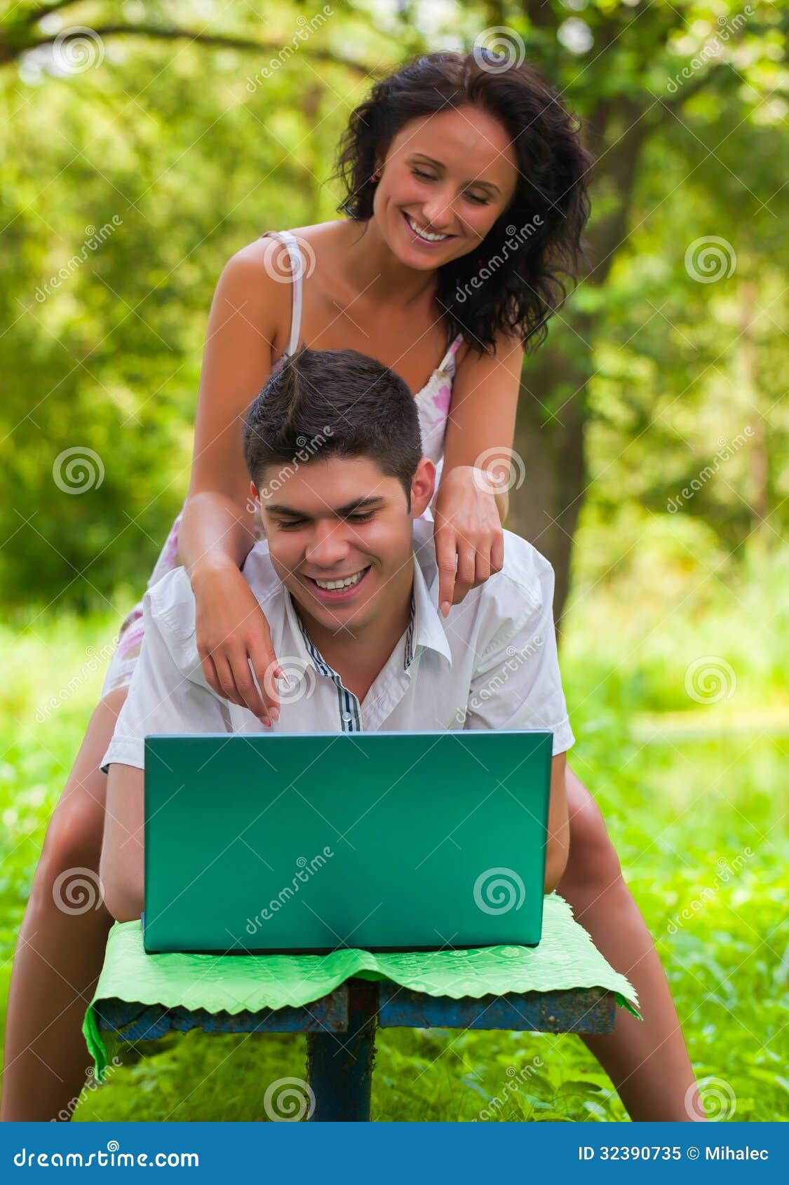 Copule with laptop in park stock image. Image of lifestyles - 32390735