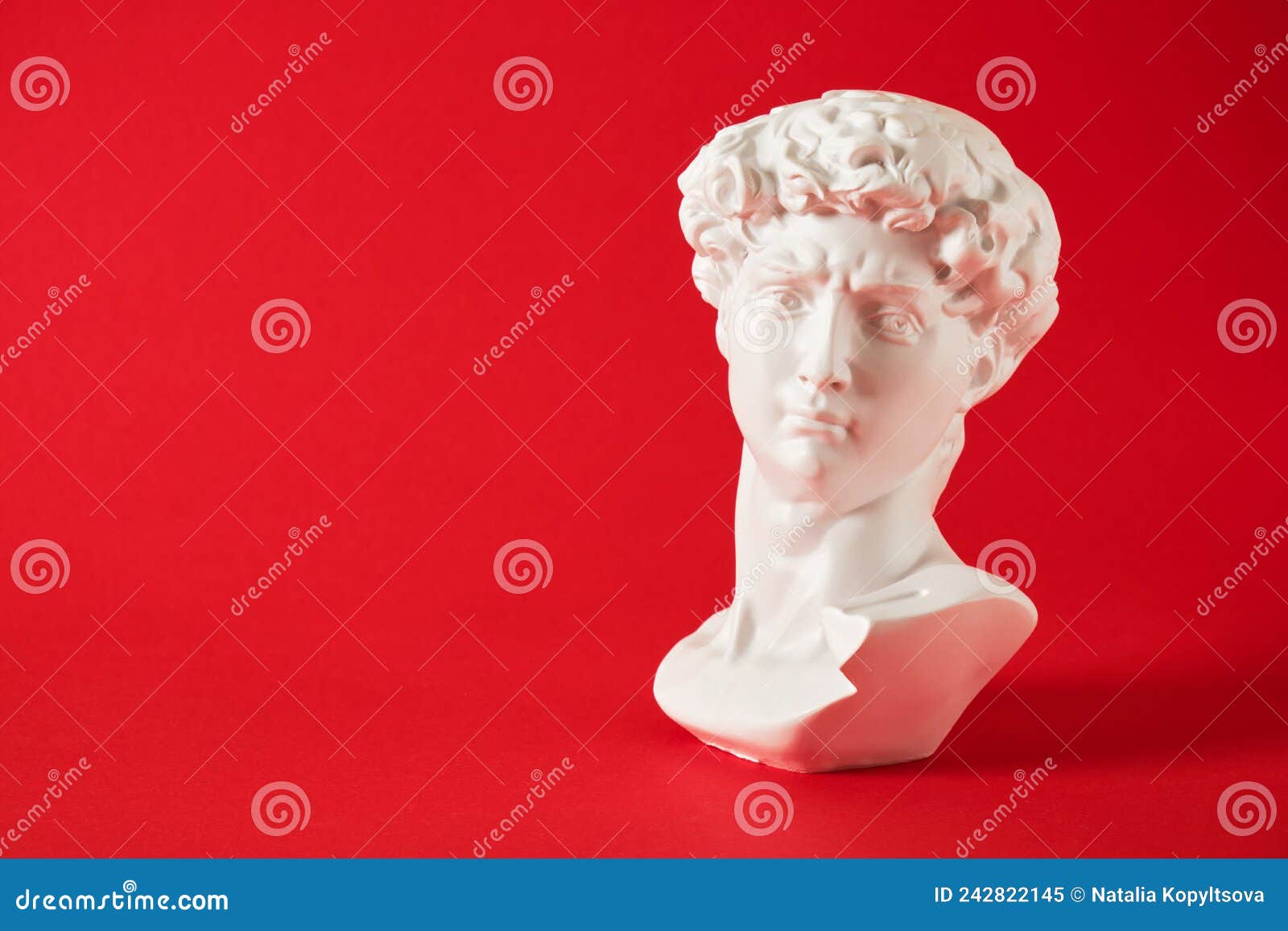 Copy of the Head of an Antique Statue of David on a Red Background ...