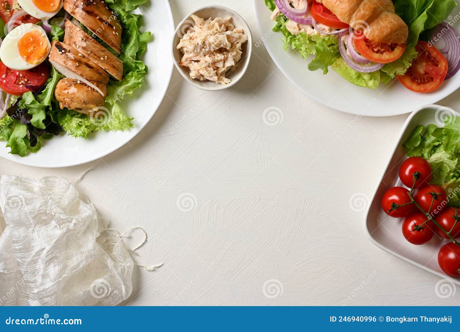 A Copy Space on White Dining Table Background Surrounded with Healthy ...