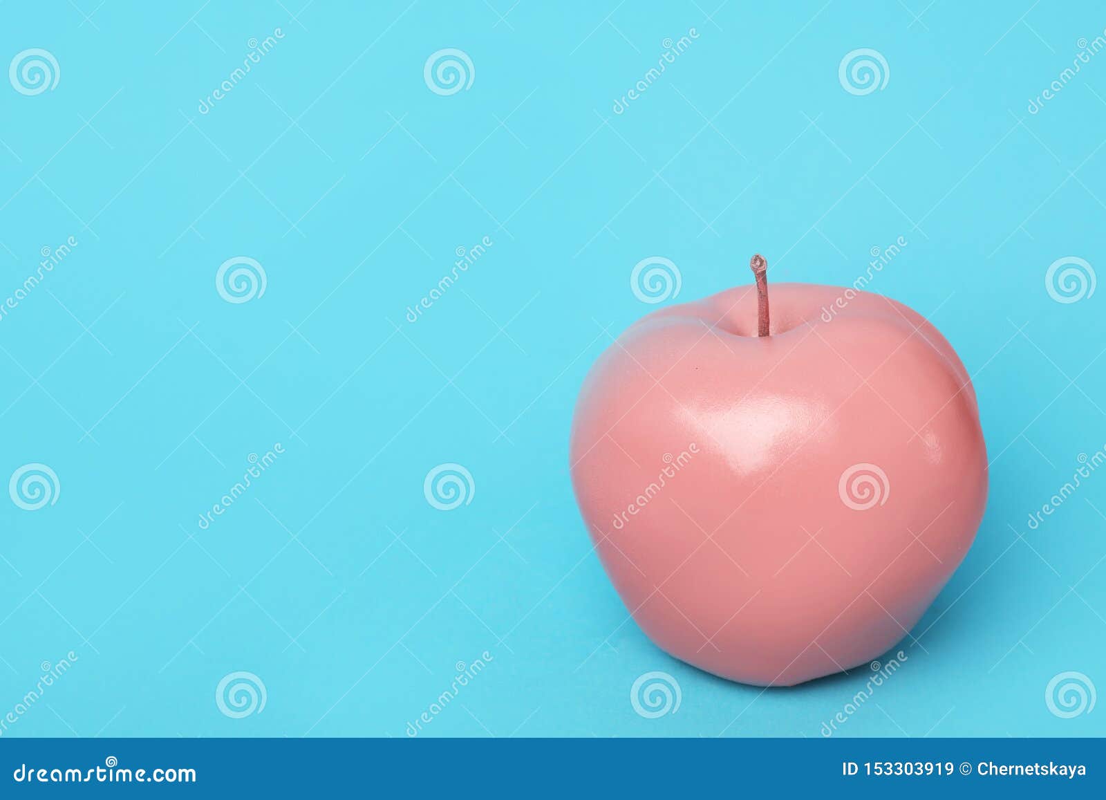 Coral Painted Apple on Light Blue Background Stock Image - Image of ...