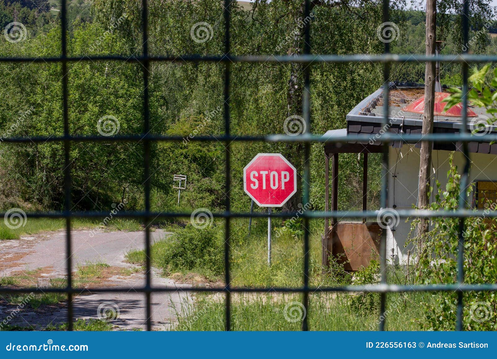 Cordoned Off Path in the Forest with a Stop Sign Stock Image - Image of ...