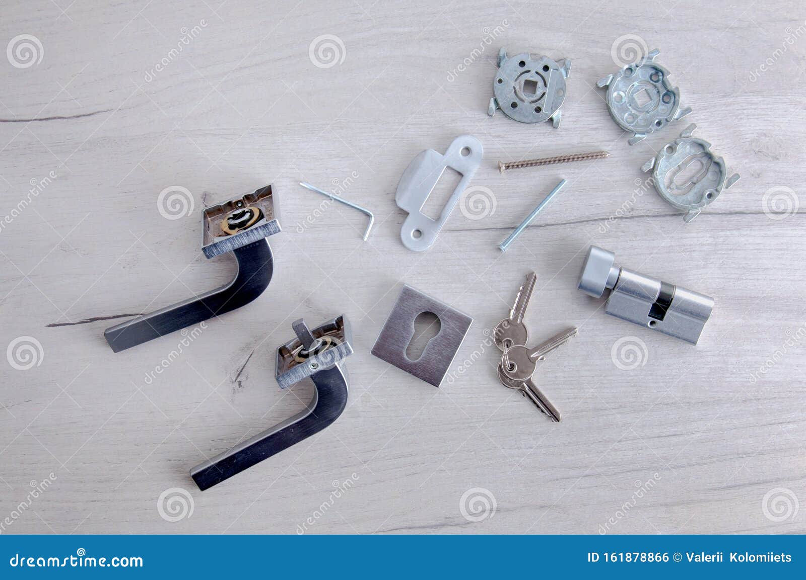 The Core of the Lock, Handles and Door Keys on a Light Background ...