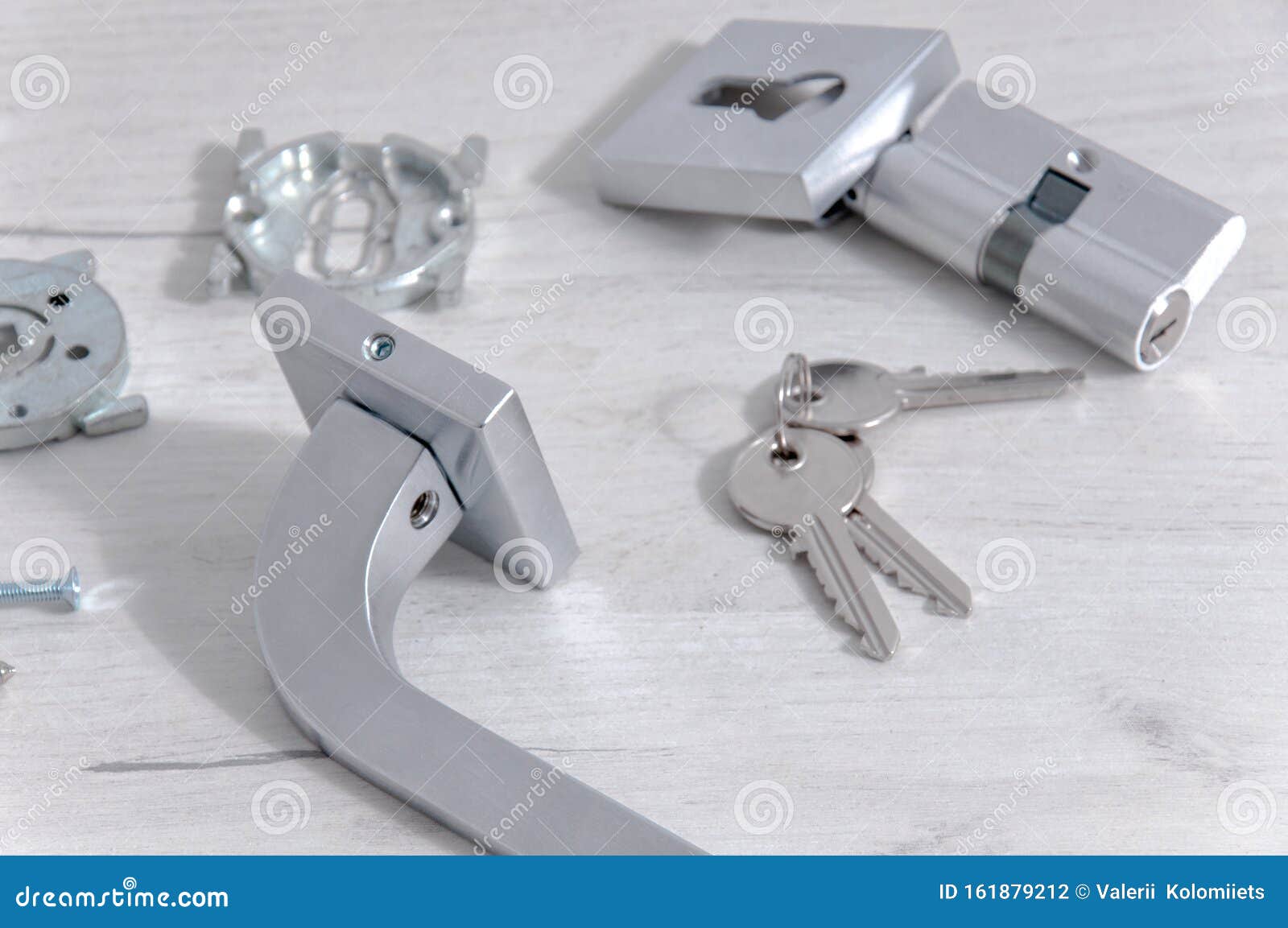 The Core of the Lock, Handles and Door Keys on a Light Background ...