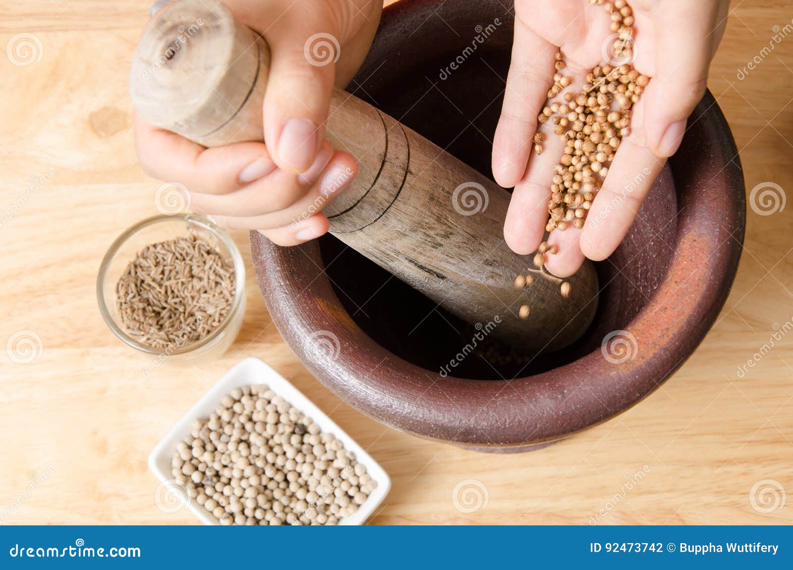 Coriander Seed Pounding in Mortar Stock Photo - Image of herb, pounding ...