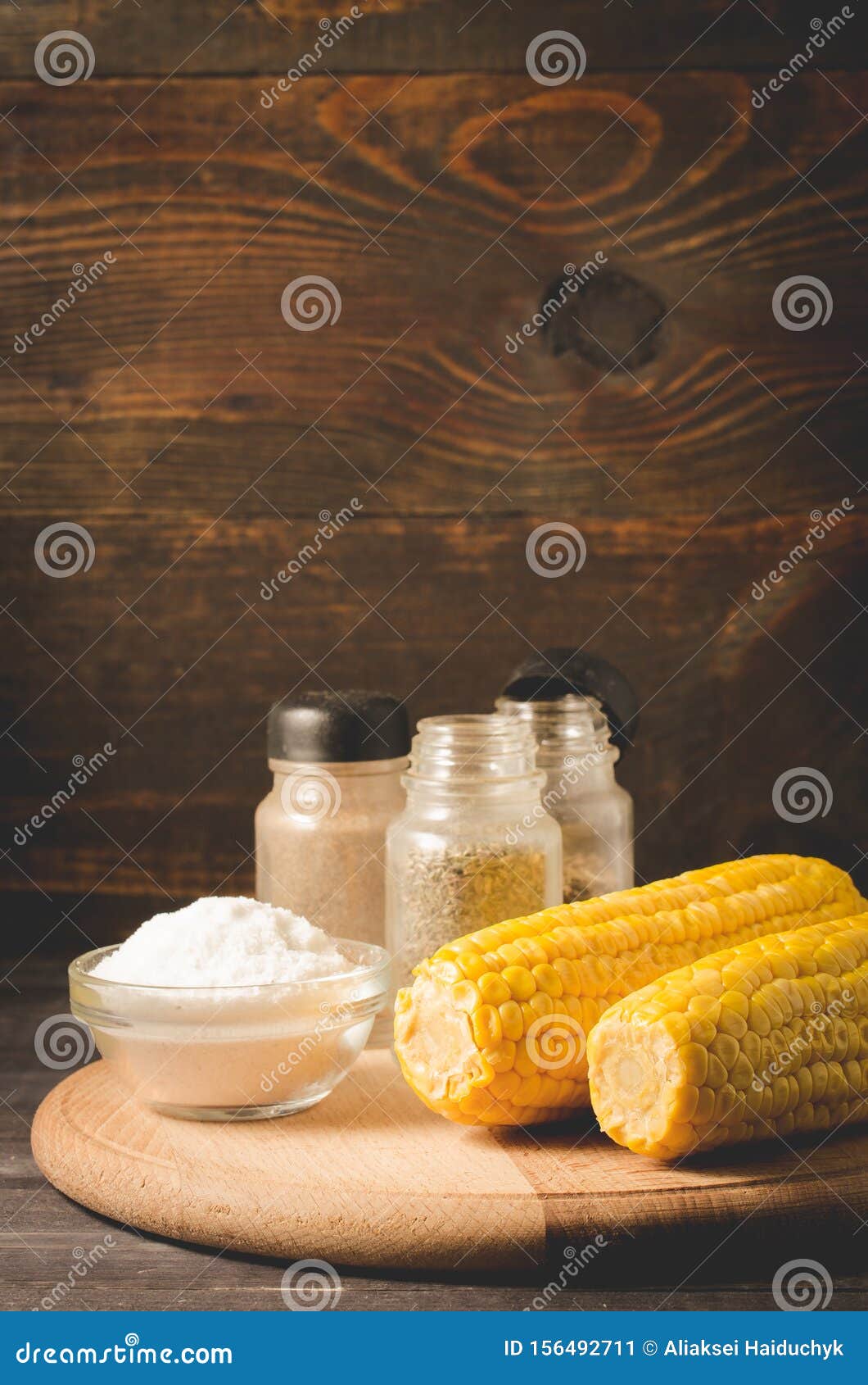 Corn. Appetizing Boiled Corn with Salt and Seasonings on a Wooden Table ...