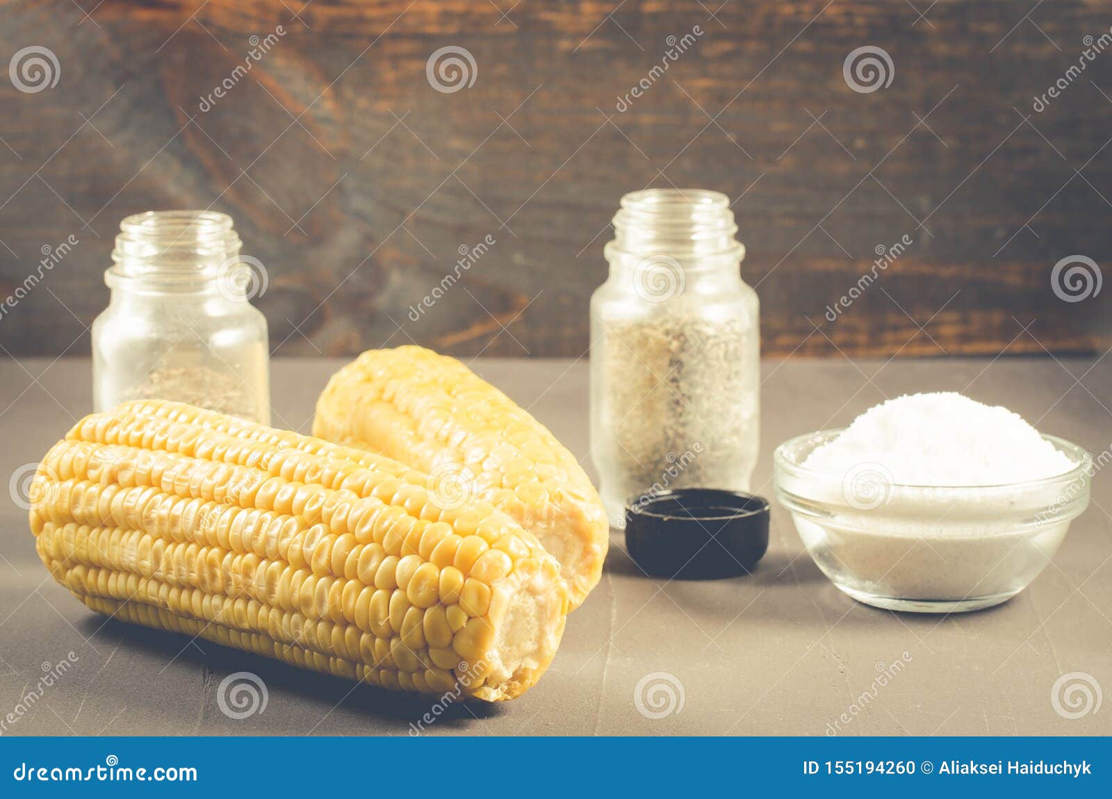 Corn. Boiled Corn with Salt and Seasonings on a Dark Table Stock Photo ...