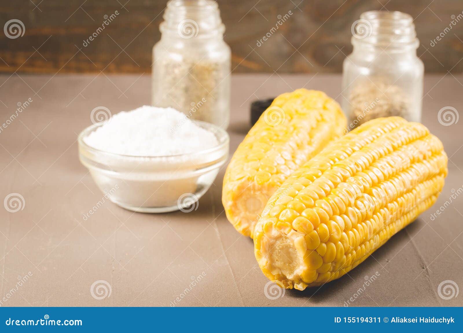 Corn. Boiled Corn with Salt and Seasonings on a Dark Table Stock Image ...