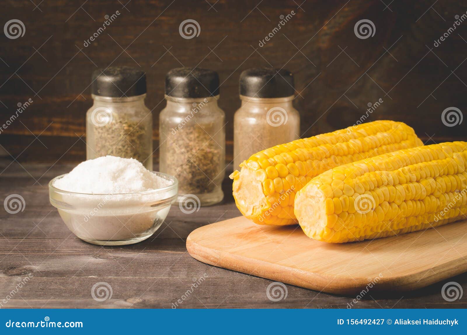 Corn. Boiled Corn with Salt and Seasonings on a Dark Table Stock Image ...