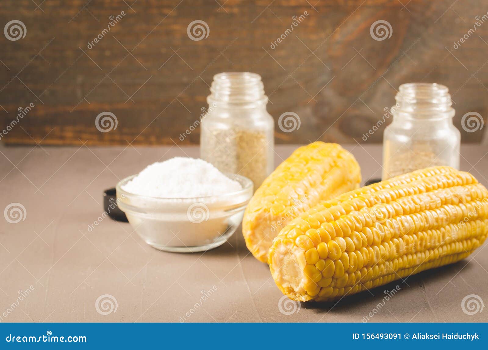 Corn. Boiled Corn with Salt and Seasonings on a Dark Table Stock Image ...