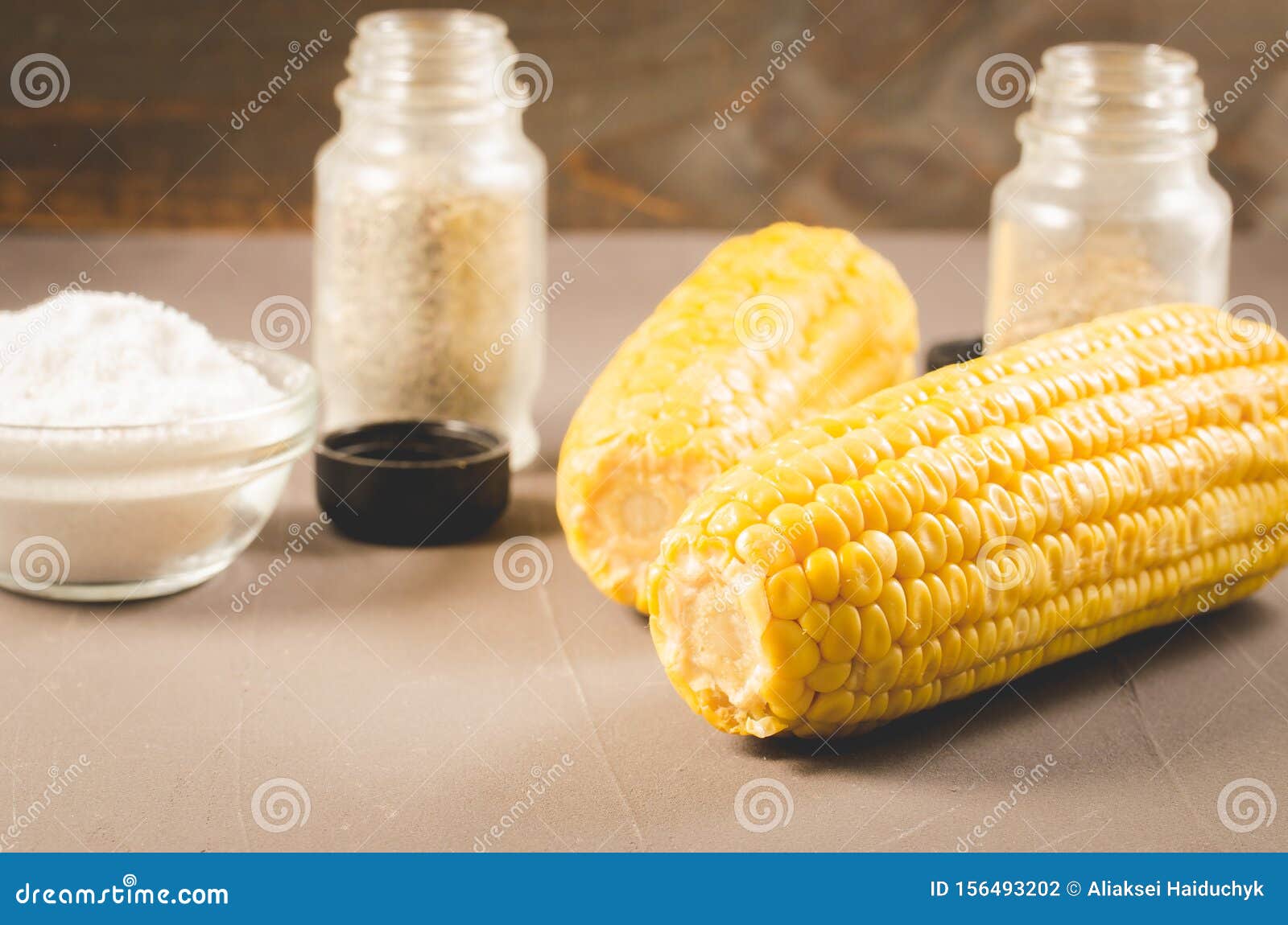 Corn. Boiled Corn with Salt and Seasonings on a Dark Table Stock Photo ...