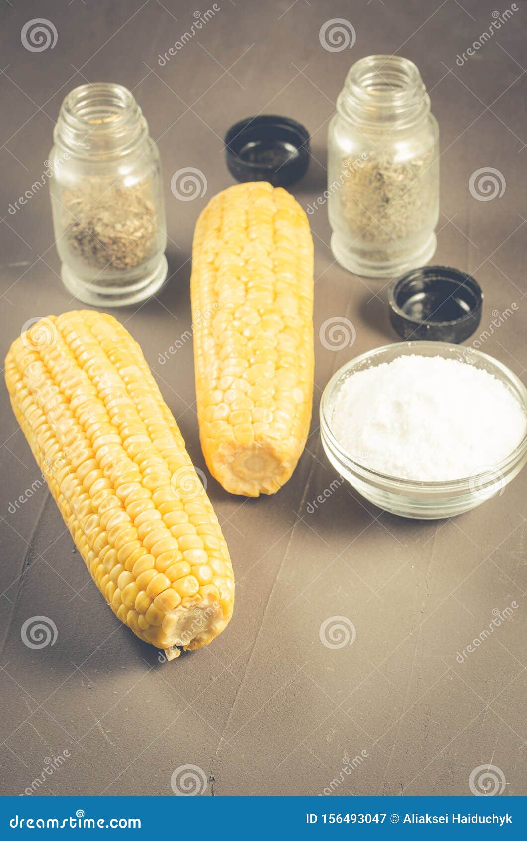 Corn. Boiled Corn with Salt and Seasonings on a Dark Table Stock Image ...