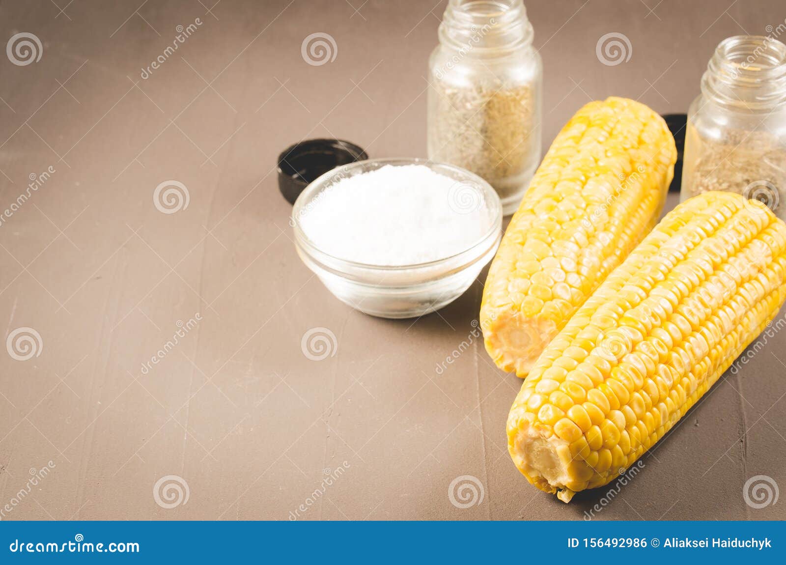 Corn. Boiled Corn with Salt and Seasonings on a Dark Table Stock Photo ...