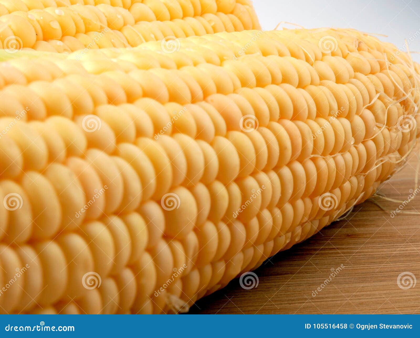 Corn Cob on Wooden Plank on White Stock Photo - Image of ingredient ...