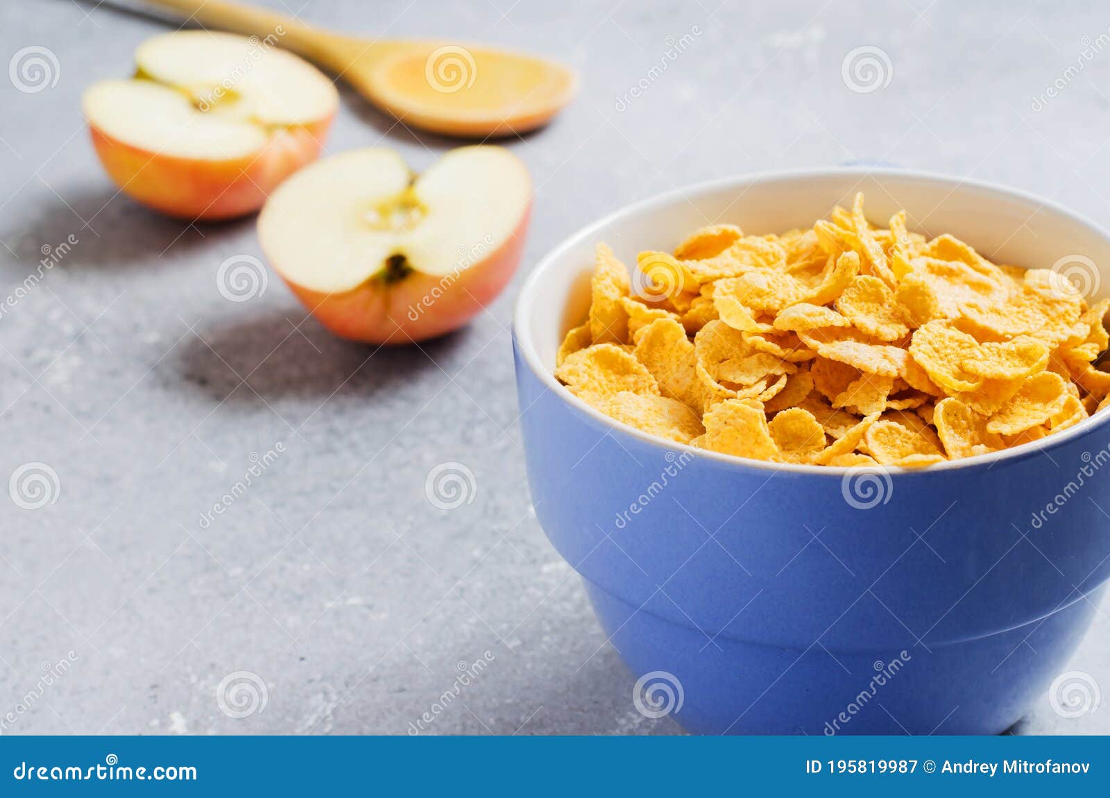 Corn Flakes in a Blue Cup and Apple Slices. Useful Breakfast in the ...