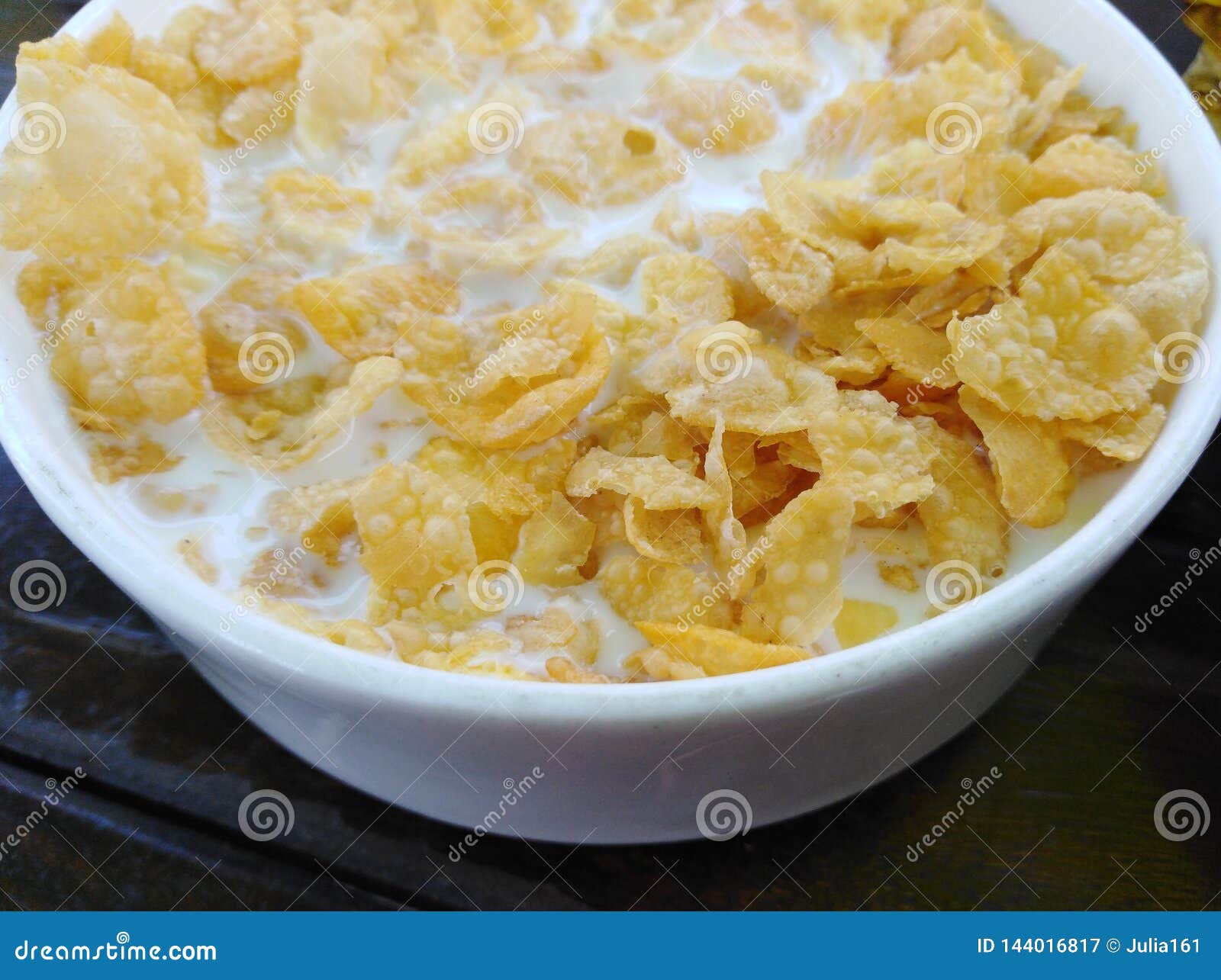 Corn Flakes in milk stock image. Image of dish, corn - 144016817
