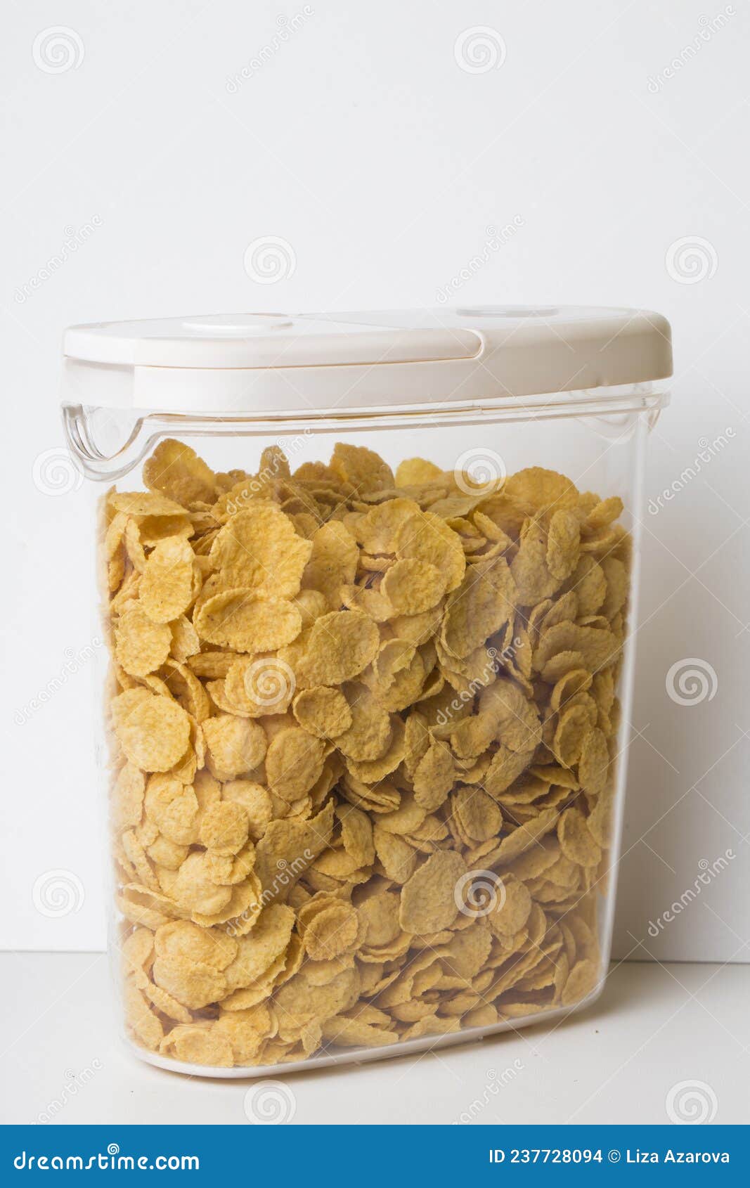 Corn Flakes in a Plastic Food Container Jar with White Lid Isolated on ...