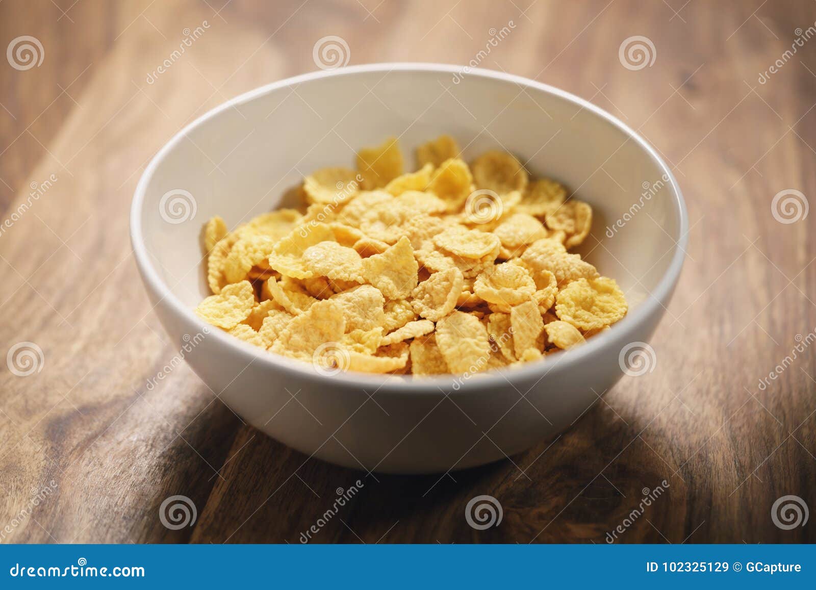 Corn Flakes in White Bowl on Table Closeup Stock Image - Image of ...
