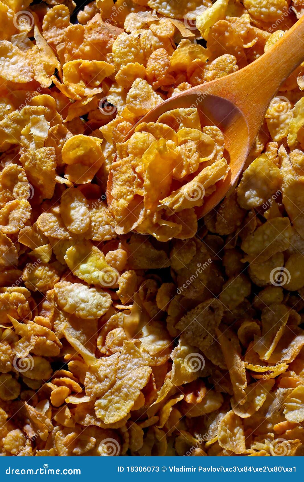 Corn Flakes and Wooden Spoon Stock Image - Image of yellow, processed ...