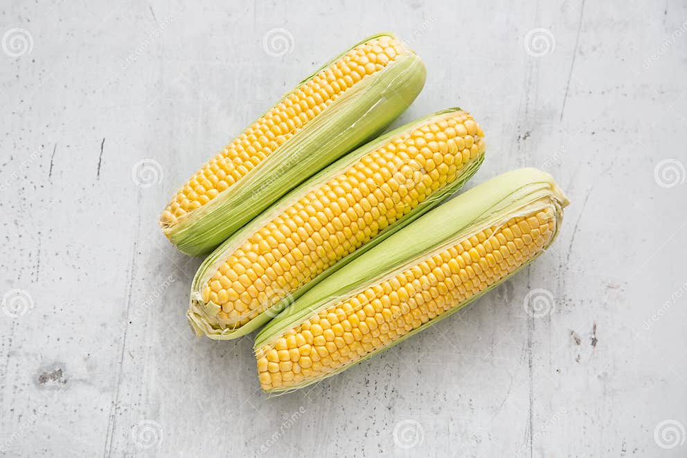 Corn. Fresh Corn on White Concrete Board Stock Image - Image of rustic ...