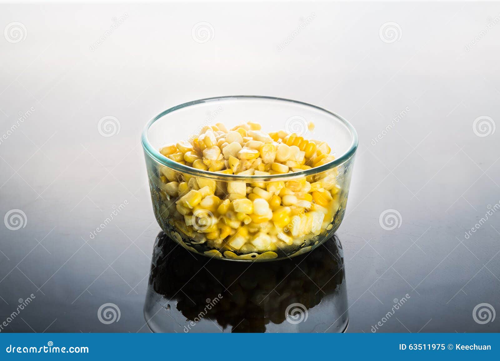 Corn Kernels in Transparent Glass Bowl in Dark Reflective Backg Stock ...