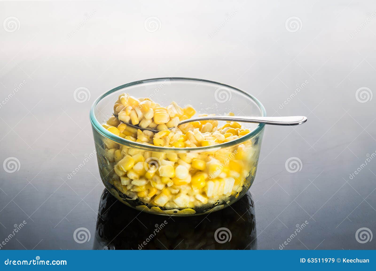 Corn Kernels in Transparent Glass Bowl in Dark Reflective Backg Stock ...