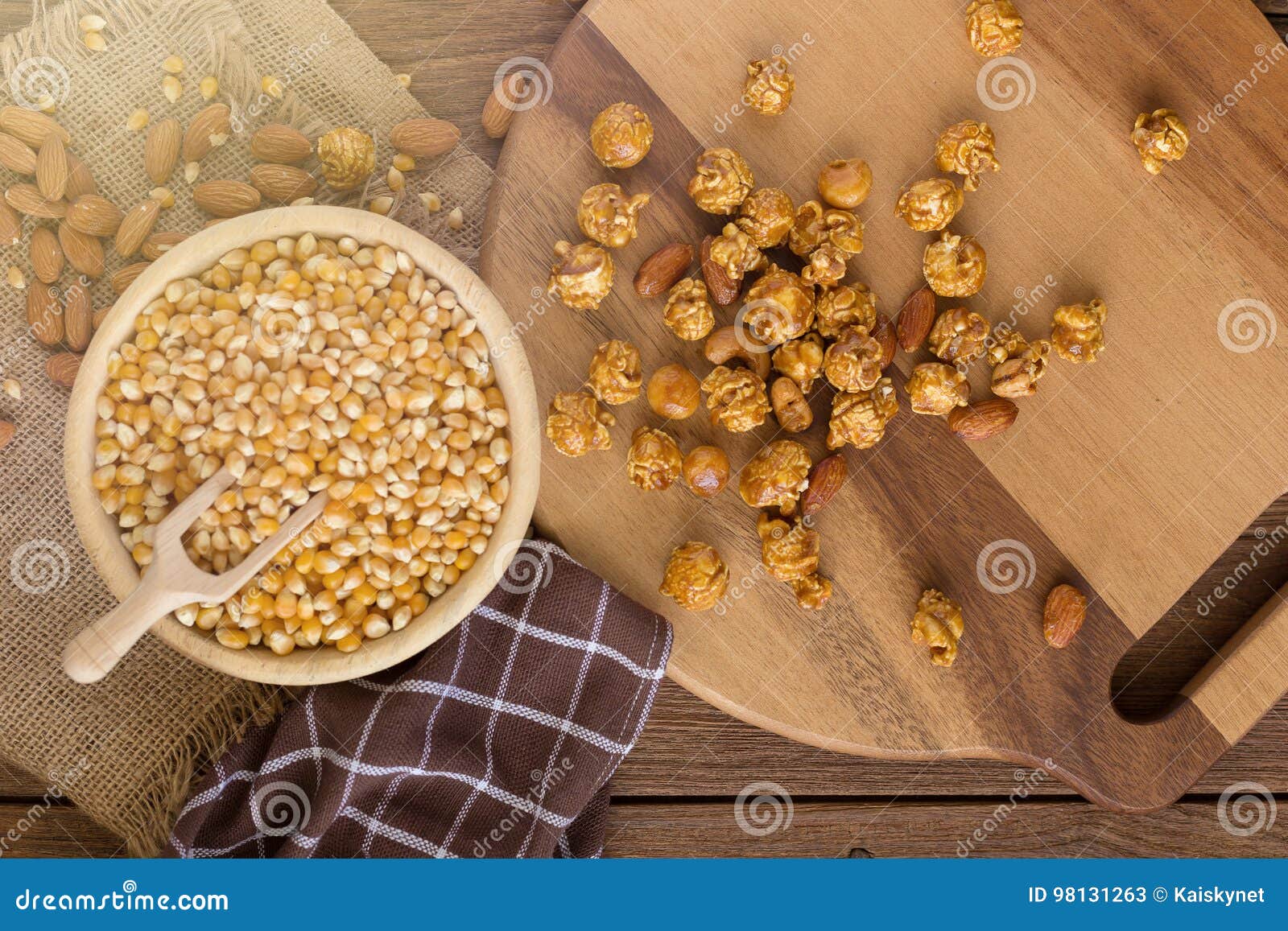 Corn Kernels in Wooden Plates and Popcorn with Caramel and Almond Cream ...