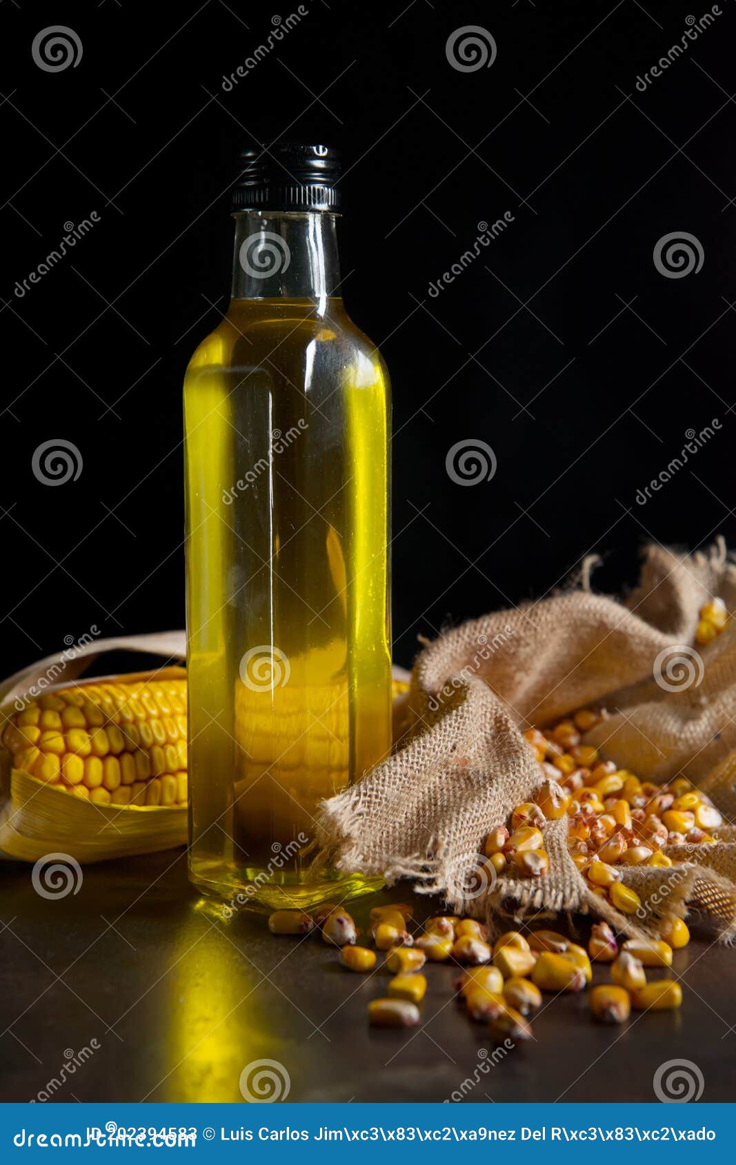 Corn Oil with Cobs on Black Background Stock Image - Image of ...