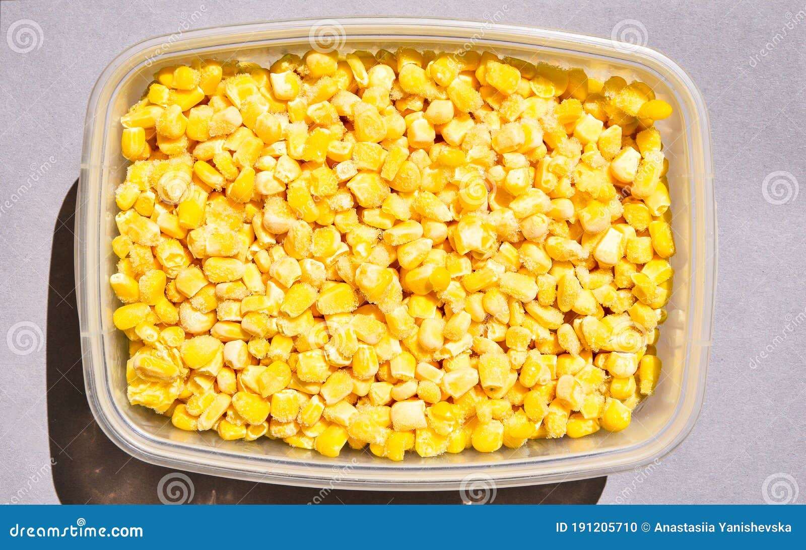 Corn in a Plastic Container for Long-term Storage. Deep Freezing of ...