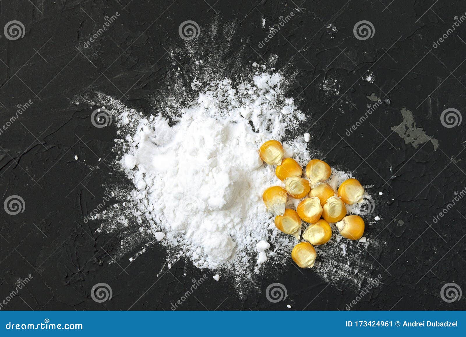 Corn Starch with Yellow Grains on a Black Background, Top View. Corn ...