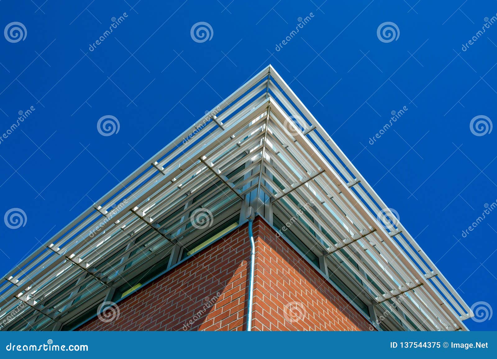 Corner of a Building Roof with Shadowing Grid Above the Windows. Stock ...