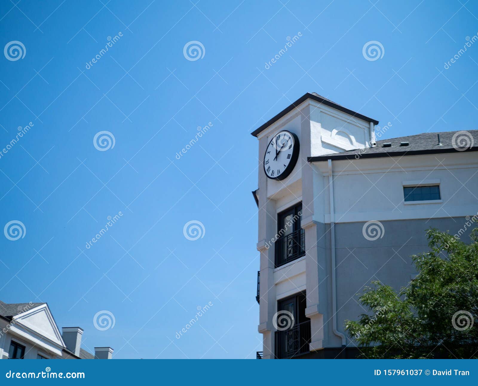 Corner of Contemporary Building with Clock Tower at 2 Oclock in ...