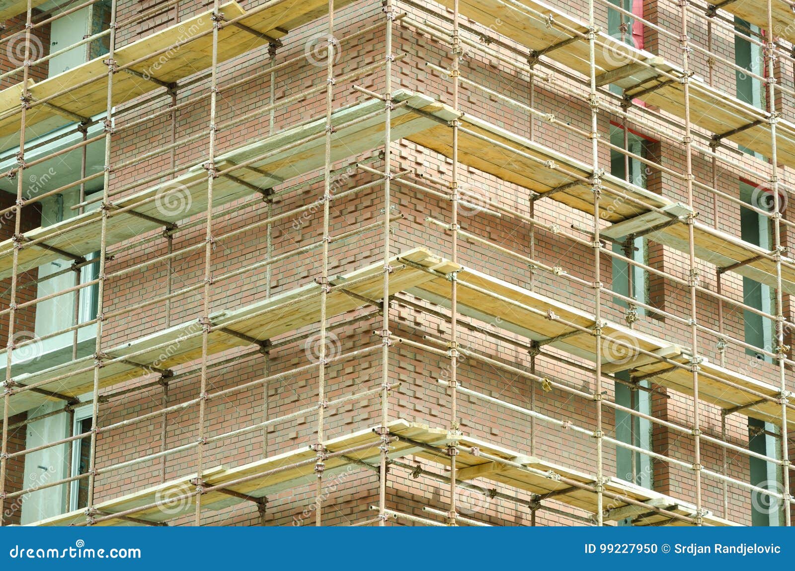Corner of Red Brick Building Construction Site with Scaffolding. Stock ...