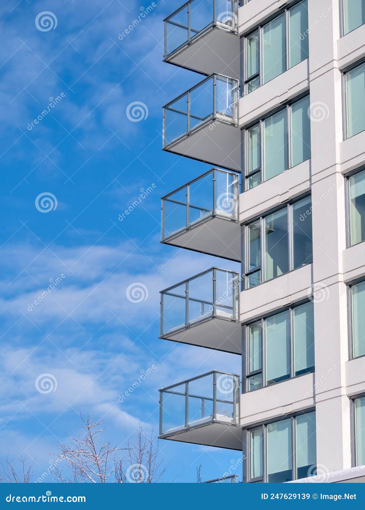 Corner of Residential High Rise Building on Blue Cloudy Sky Background ...