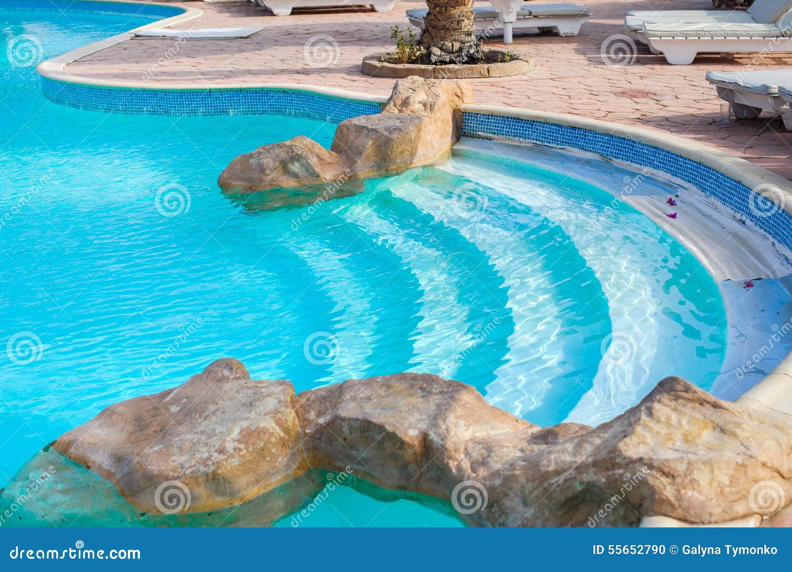 Corner of a Swimming Pool with Decorative Stones Stock Photo - Image of ...