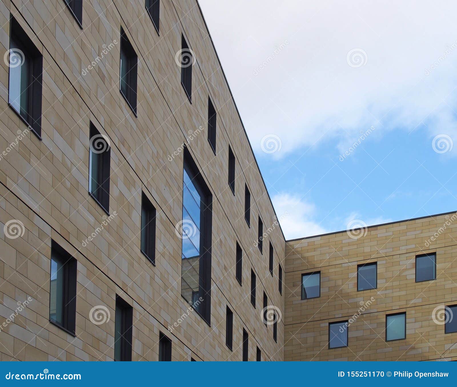 Corner View of a Modern Stone Building with Geometric Repeating Pattern ...