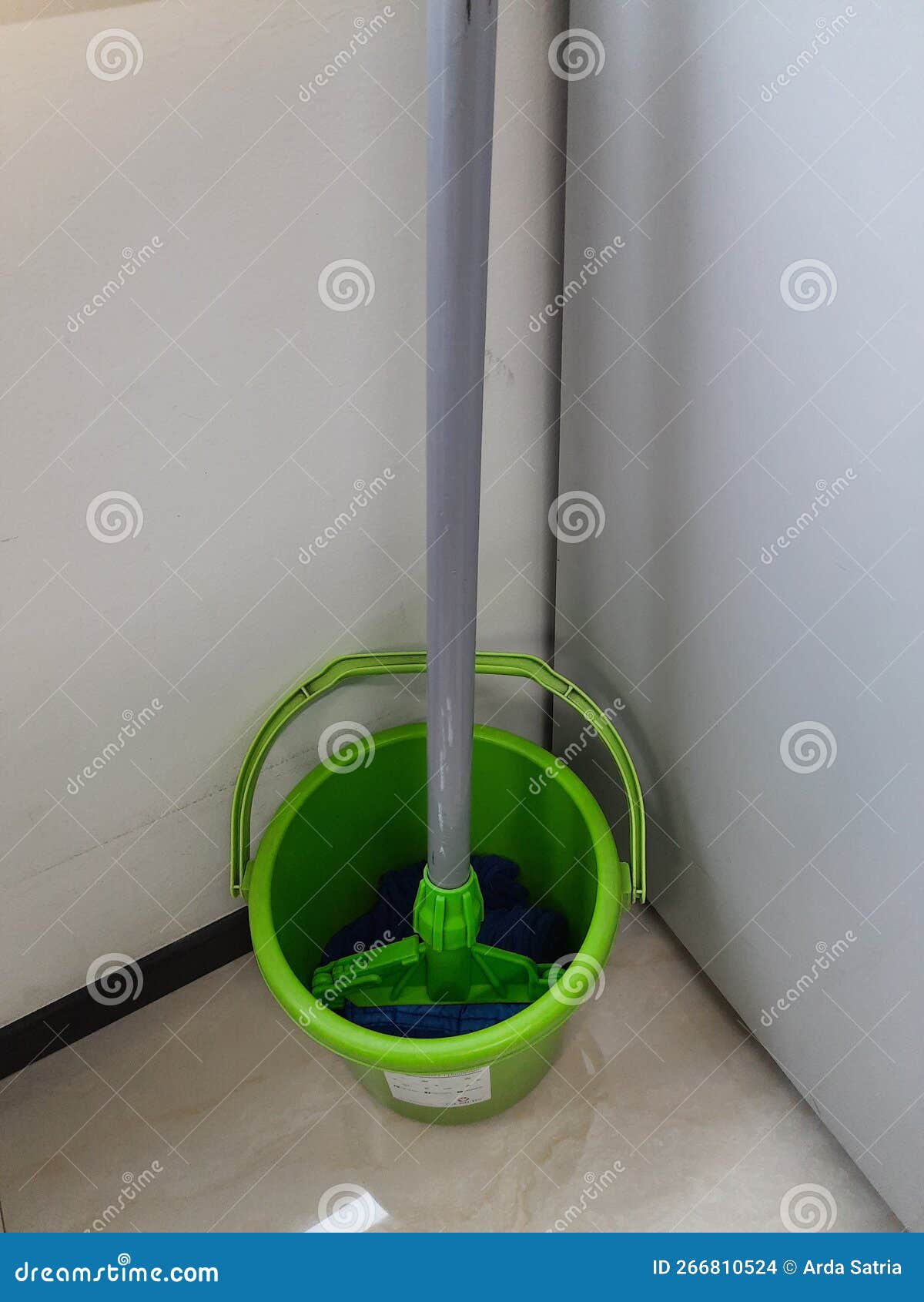 Cornered Mop Waiting for Work? Stock Photo - Image of ceiling, green ...
