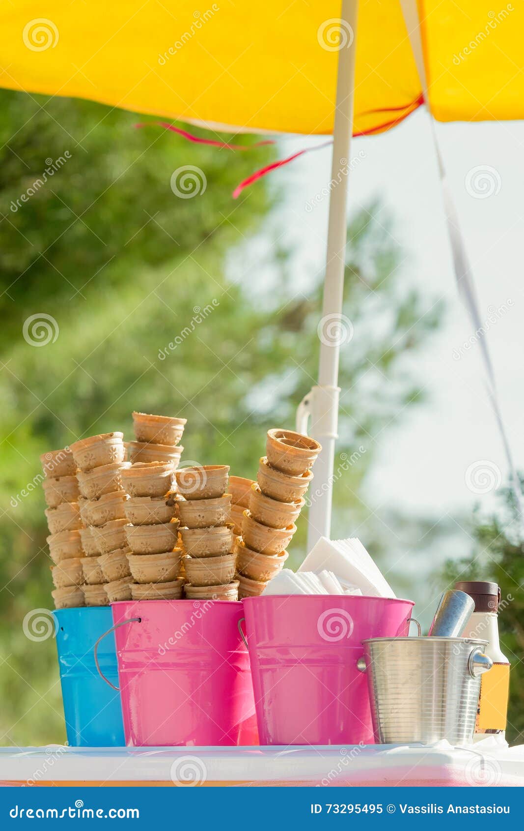 Cornets of Ice Cream Under a Yellow Umbrella. Stock Image - Image of ...