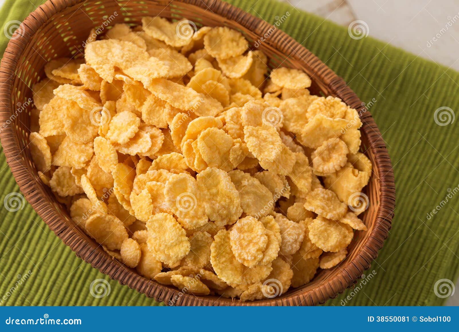 Cornflakes in Bowl on Table Stock Image - Image of orange, selective ...