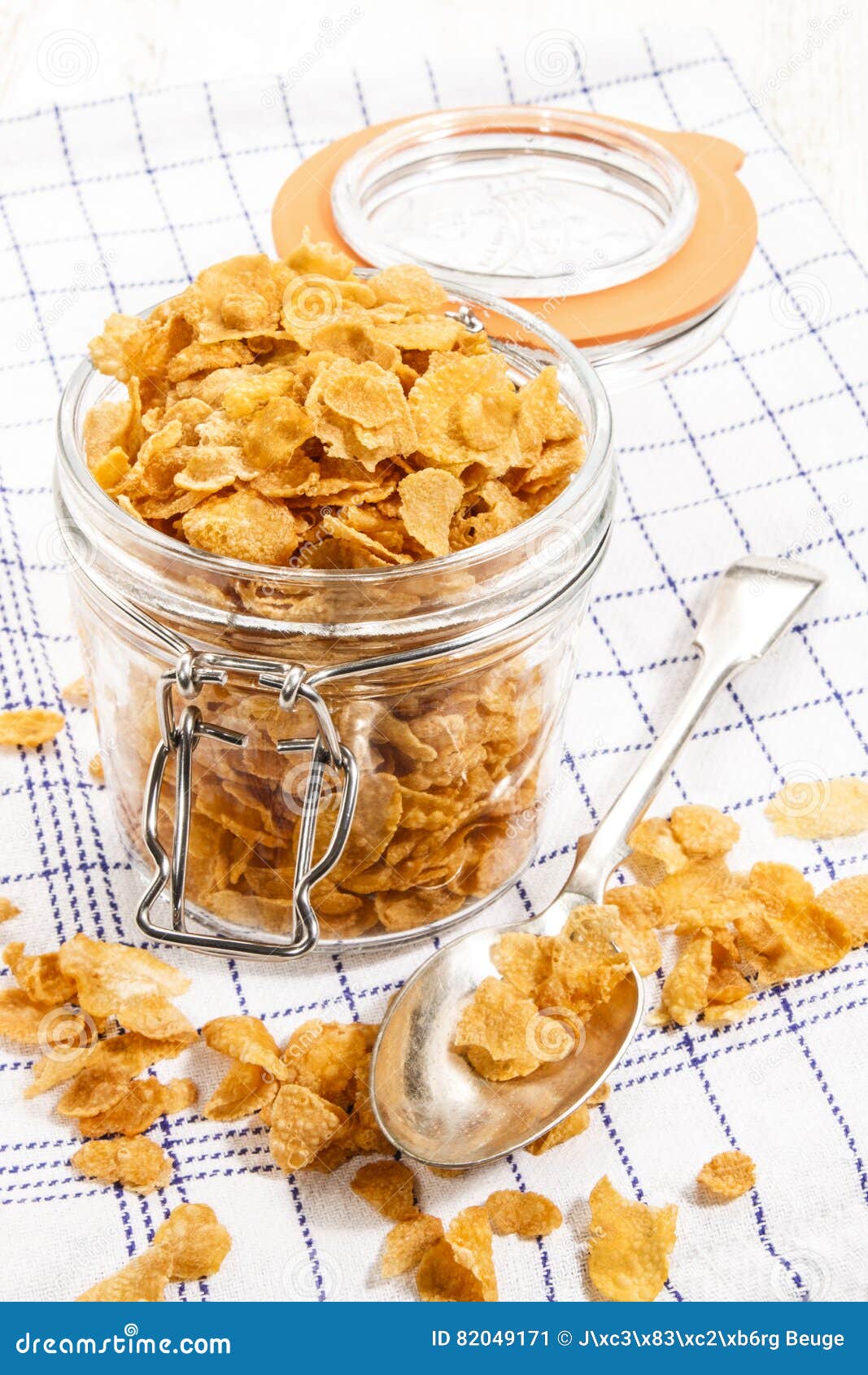 Cornflakes in a Glass Storage Container with Spoon on a Kitchen Stock ...