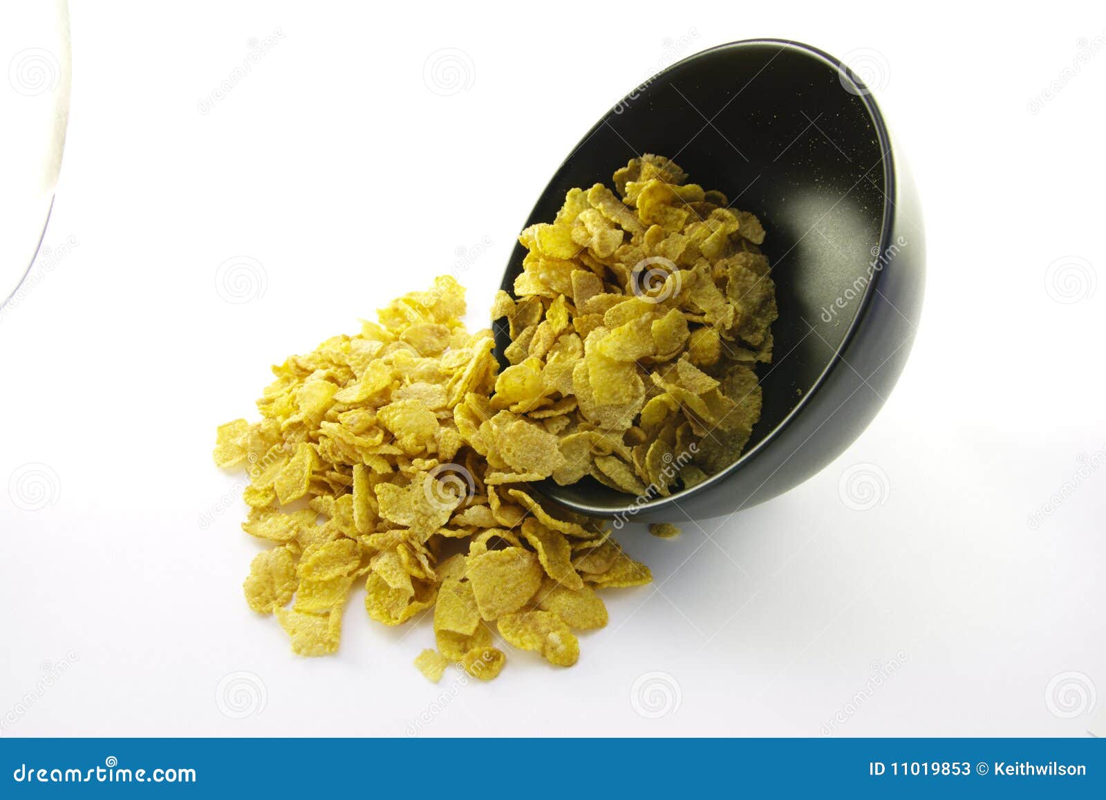 Cornflakes Spilling Out of a Bowl Stock Image - Image of product ...