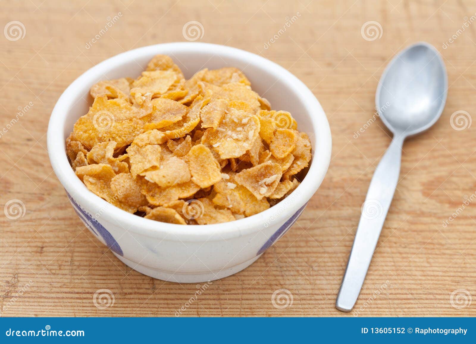 Cornflakes in a white bowl stock photo. Image of food - 13605152