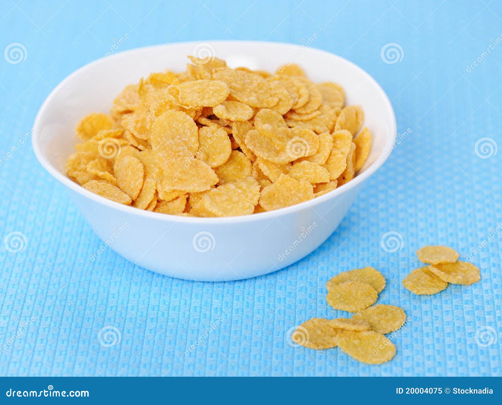 Cornflakes in a white bowl stock image. Image of corn - 20004075