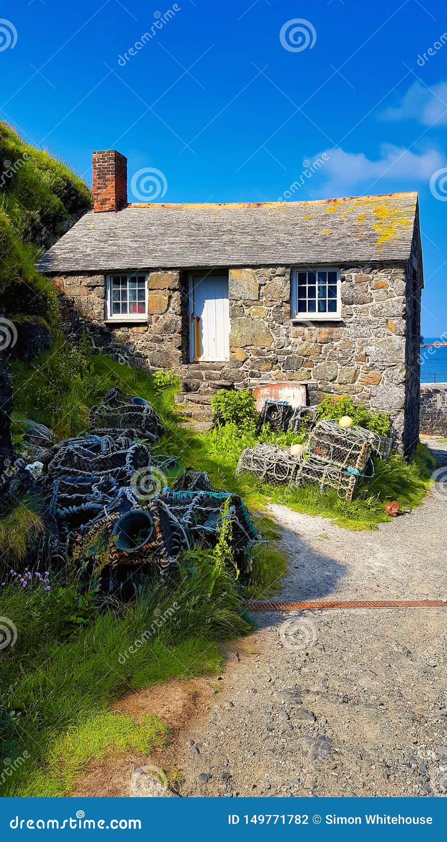 A Small Fishermans Cottage and Lobster Pots Stock Photo - Image of ...