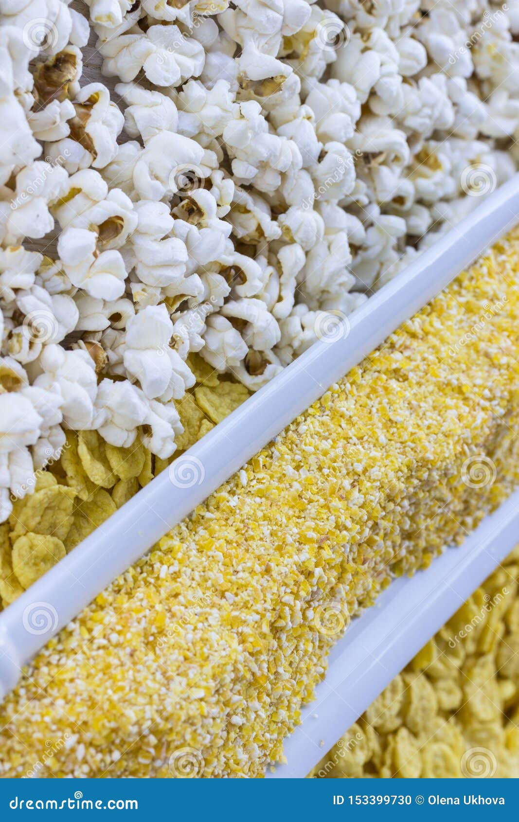 Cornmeal, Cornflakes and Popcorn in White Plates, Top View Stock Photo ...