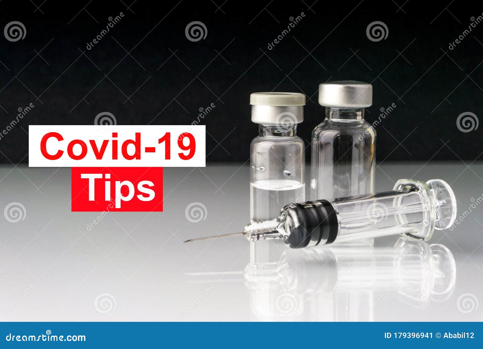 CORONAVIRUS or COVID-19 TIPS Text with Syringe and Vials on Dark ...
