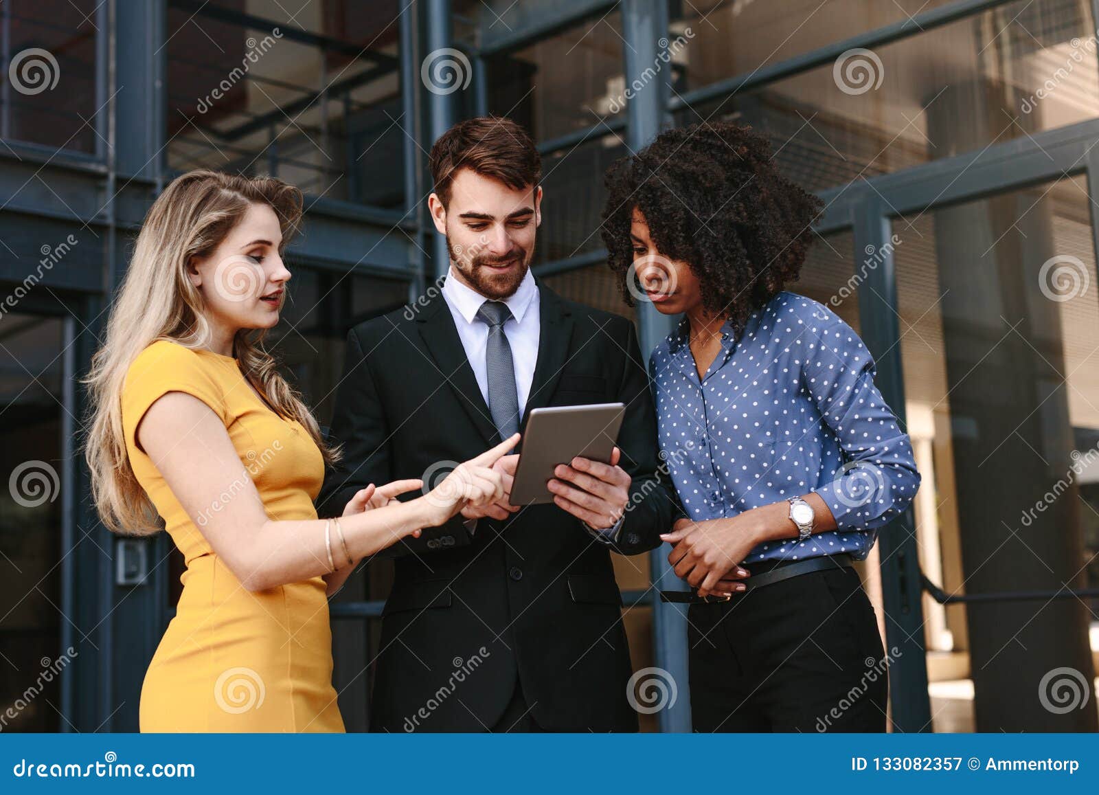 Corporate Professionals Discussing Work Using Digital Tablet Stock ...