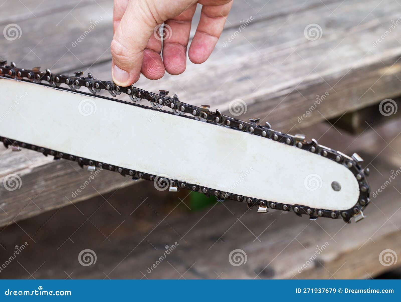 Correct Chain Tension Using the Special Tool on the Chainsaw Bar. Chain ...