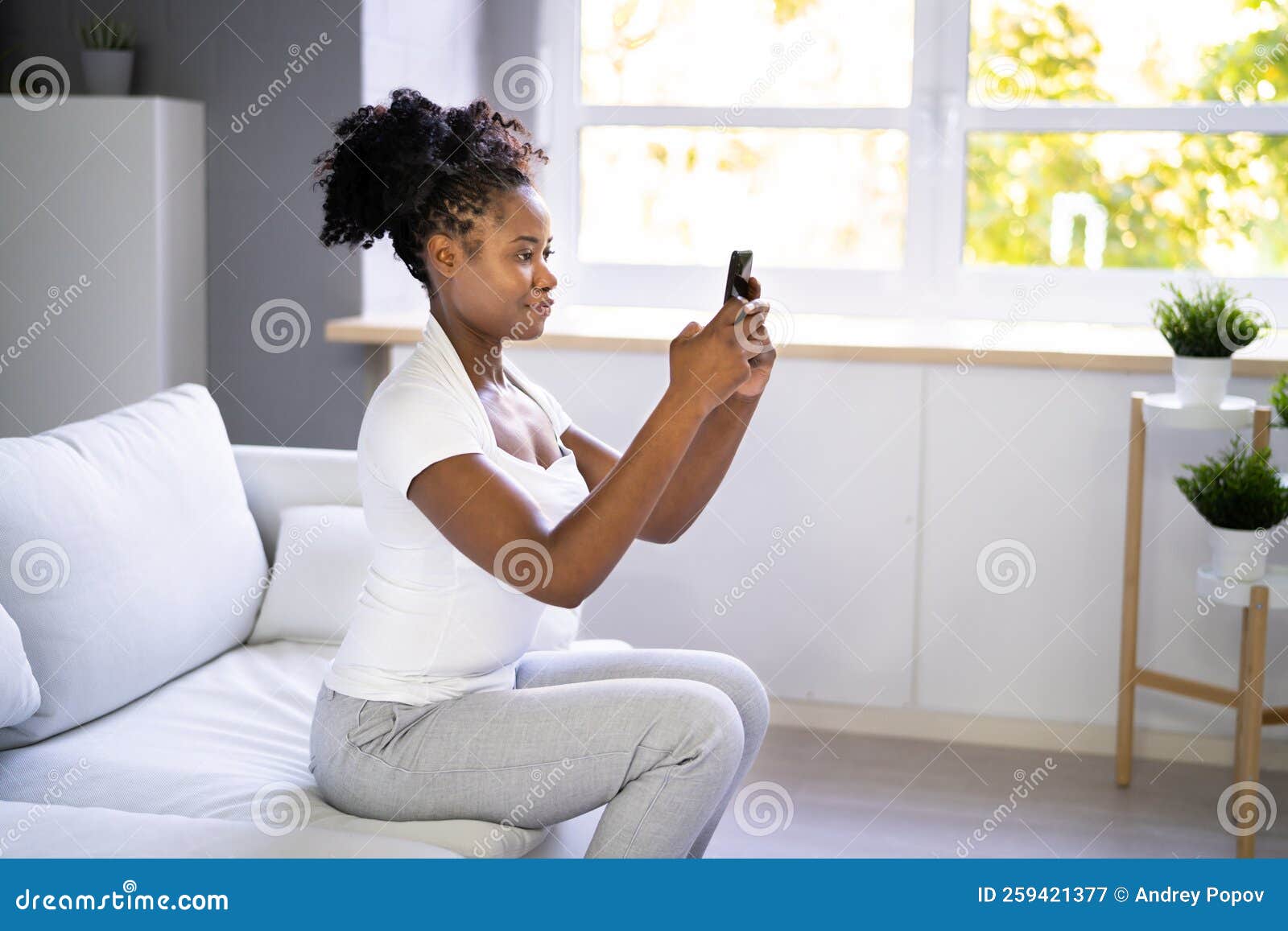 Correct Posture To Avoid Backache Using Smartphone Stock Image - Image ...